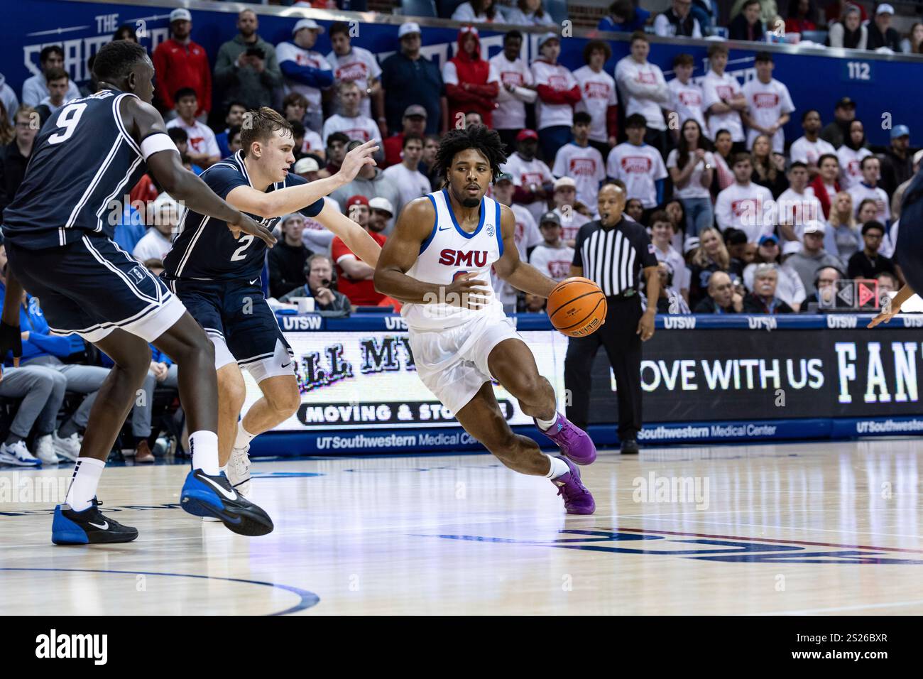 DALLAS, TX - JANUARY 04: SMU Mustangs guard Kario Oquendo (#8) dribbles ...