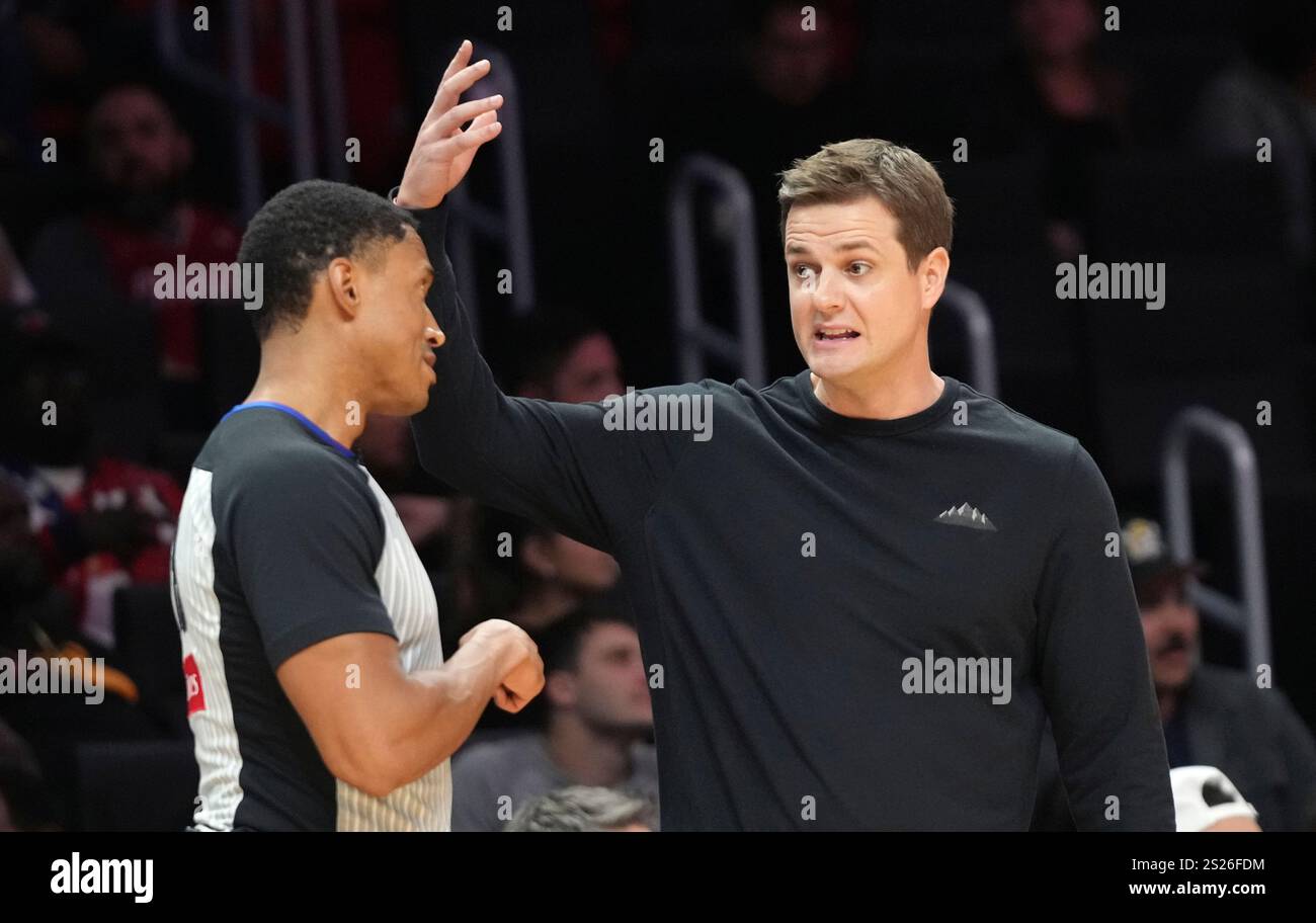 Utah Jazz head coach Will Hardy, right, talks with official Robert ...