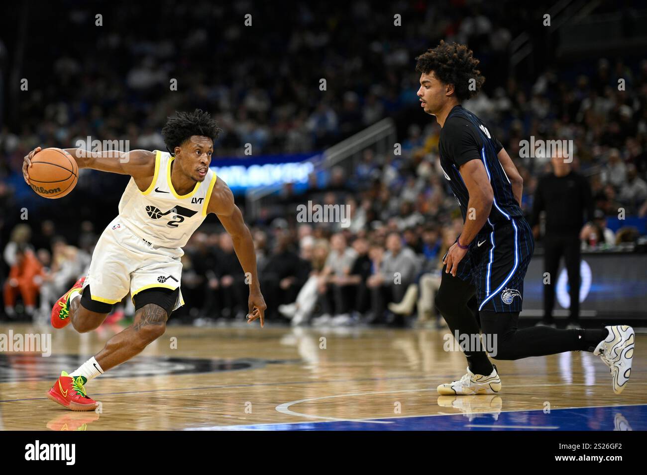 Utah Jazz guard Collin Sexton (2) is defended by Orlando Magic guard ...