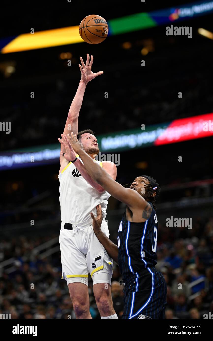 Utah Jazz forward Drew Eubanks, left, shoots in front of Orlando Magic ...