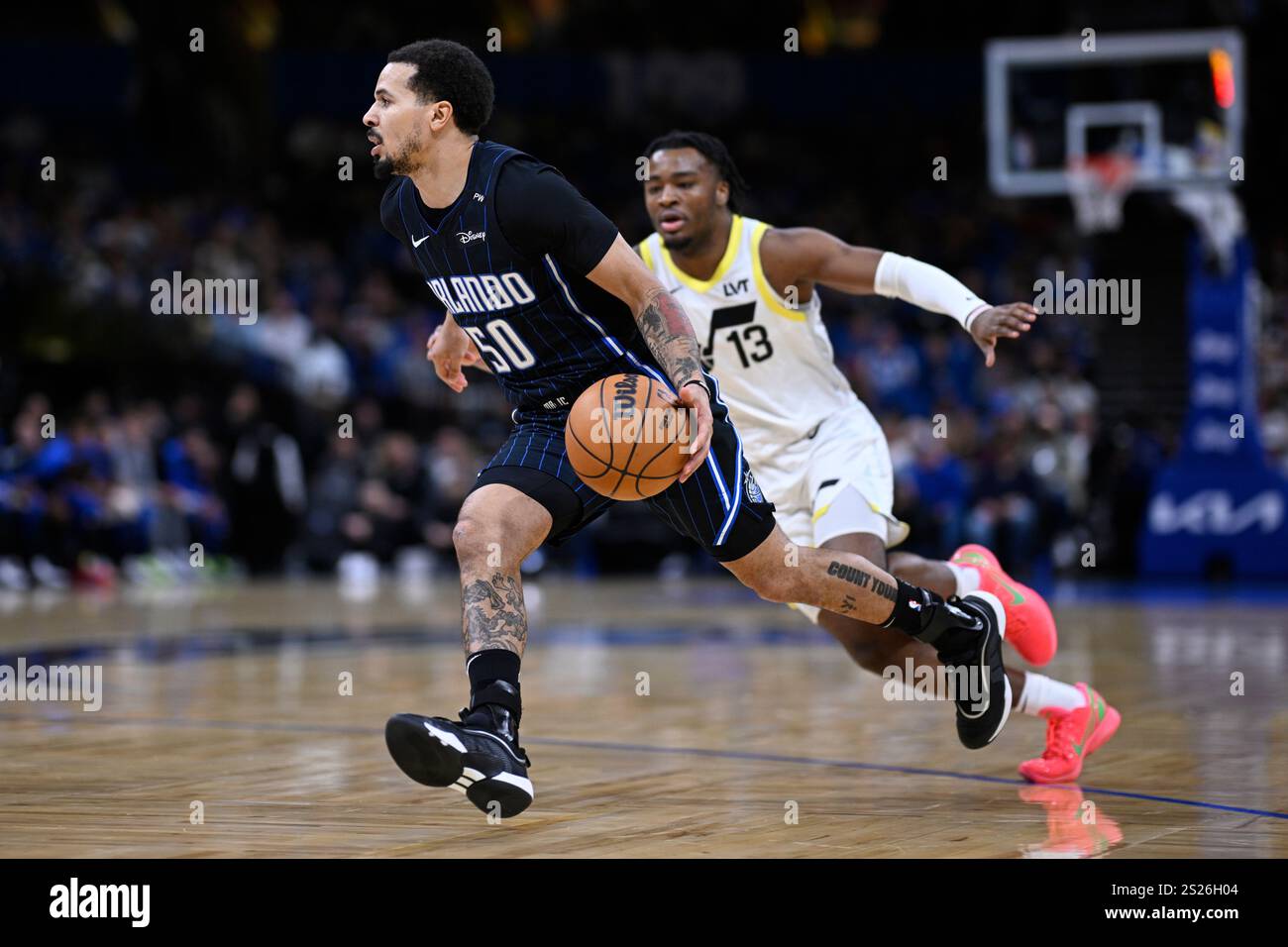 Orlando Magic guard Cole Anthony (50) drives past Utah Jazz guard ...