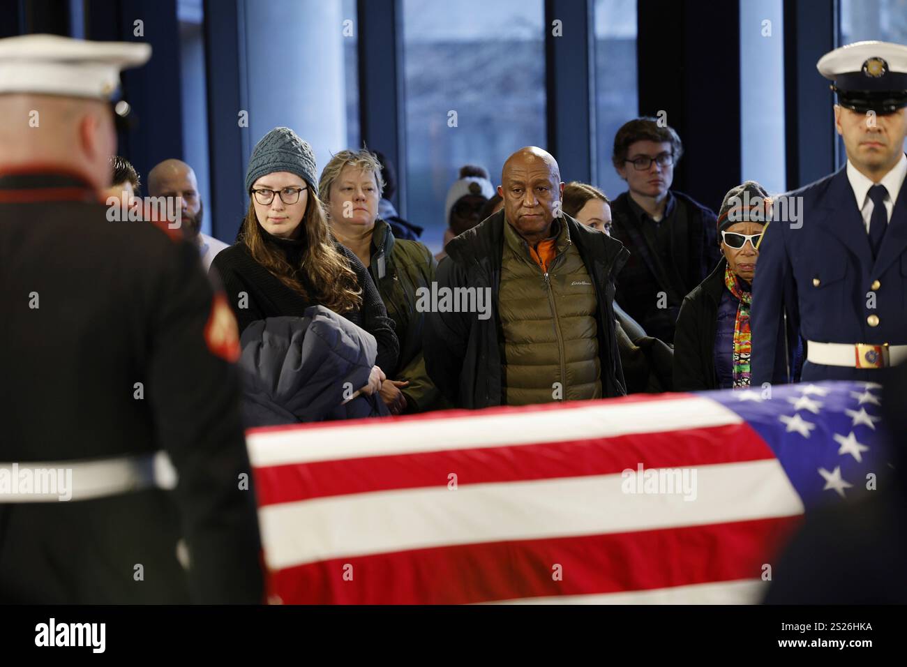 Mourners view the casket of former President Jimmy Carter as he lies in ...