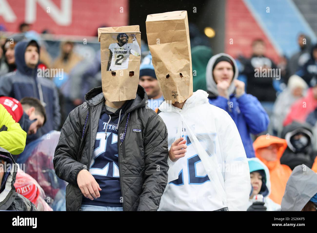 Two Tennessee Titans fans wear paper bags over their heads during the ...