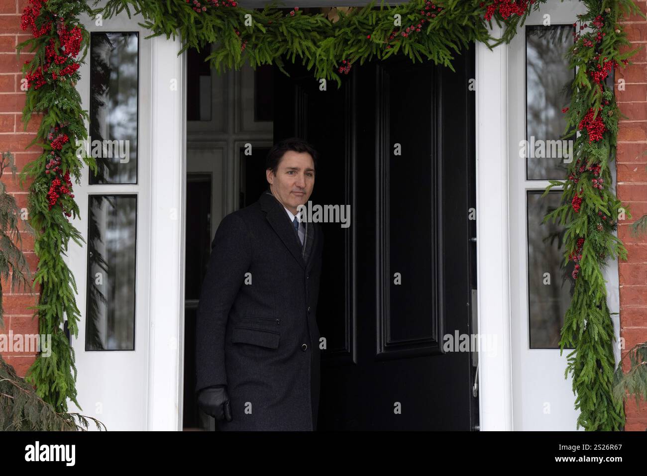 Prime Minister Justin Trudeau steps out of Rideau Cottage to speak with ...