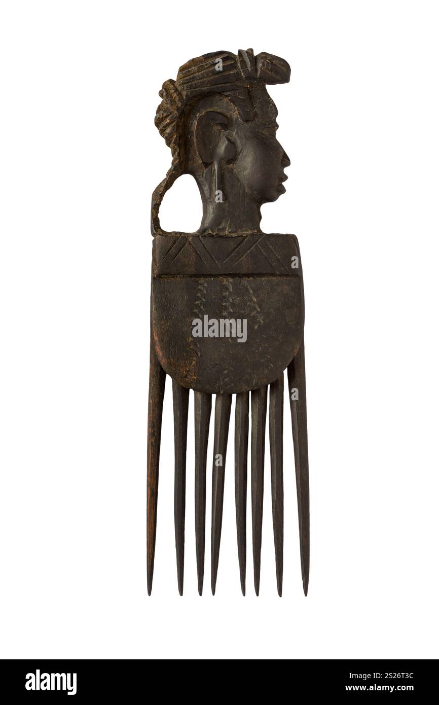 Decorative African hand carved wooden afro comb isolated on white ...