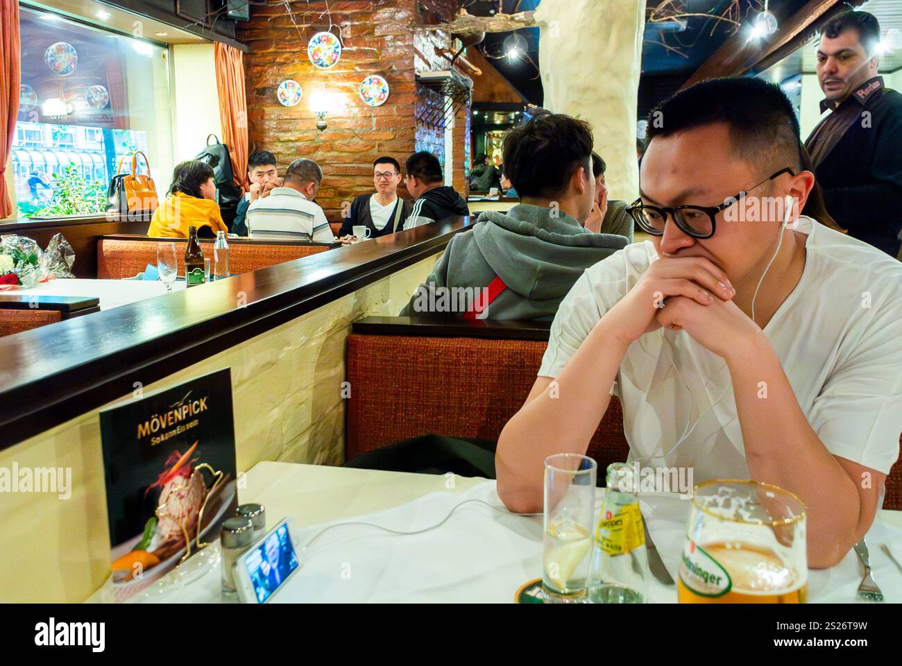 Vienna, Austria, Chinese Tourist in Austrian Restaurant, Diner Table ...