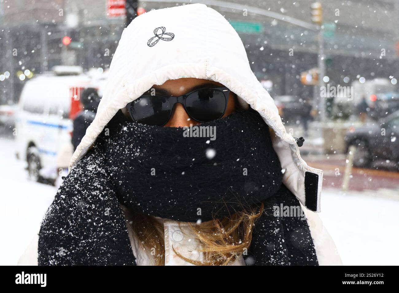 A woman walks through Union Square Park as the snow gets heavy in New ...