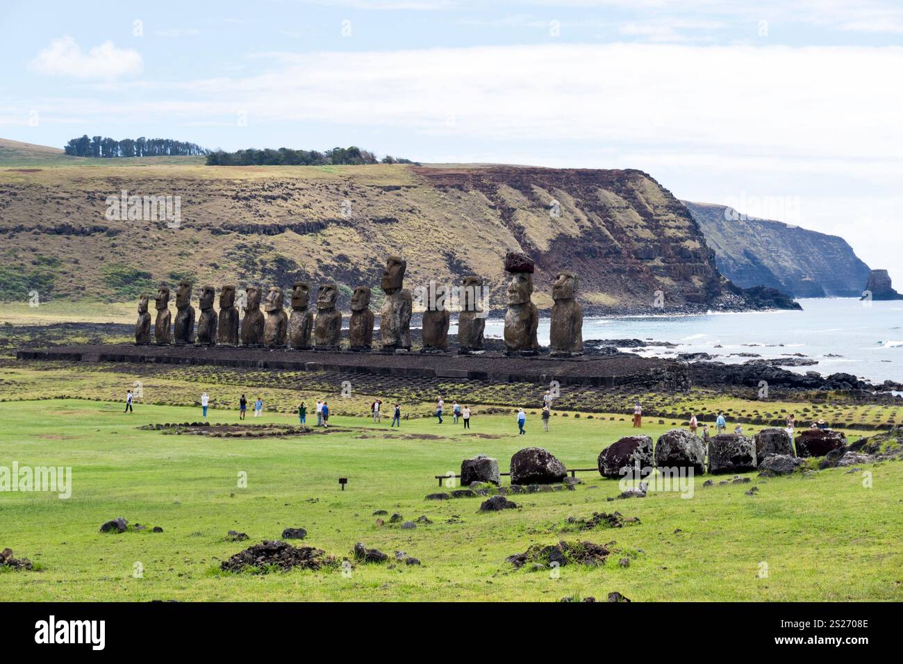 A tour group visits Ahu Tongariki, Easter Island’s largest monument ...
