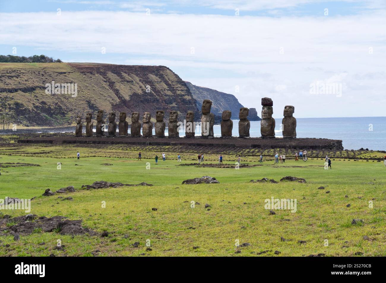 A tour group visits Ahu Tongariki, Easter Island’s largest monument ...