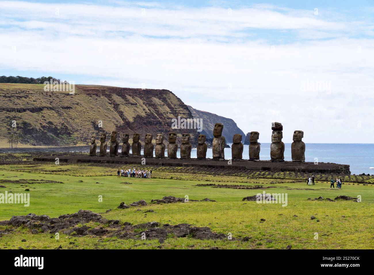 A tour group makes a group photo at Ahu Tongariki, Easter Island’s ...
