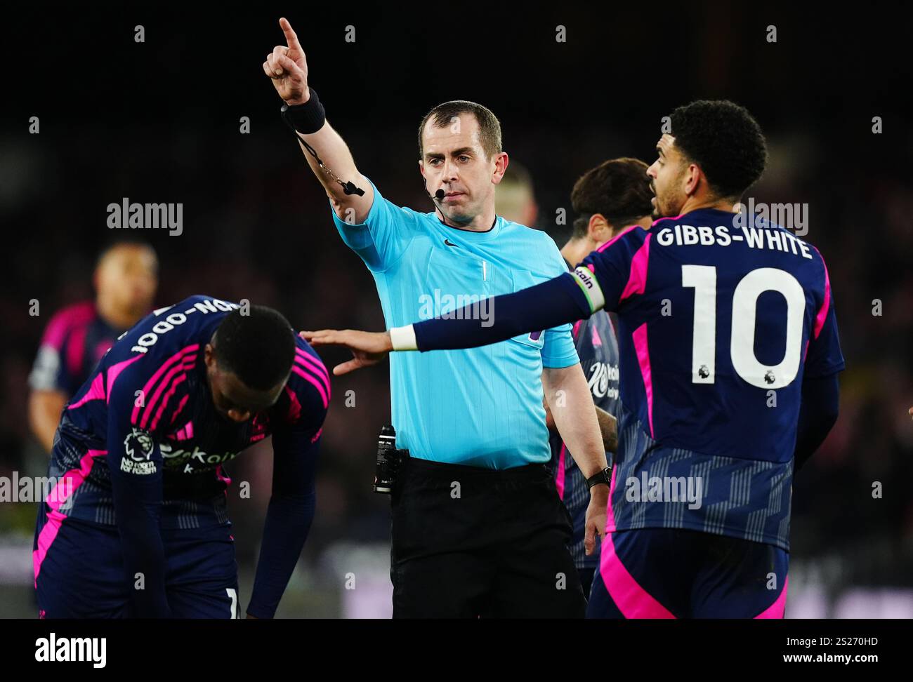 Referee Peter Bankes speaks to Nottingham Forest's Morgan Gibbs-White ...