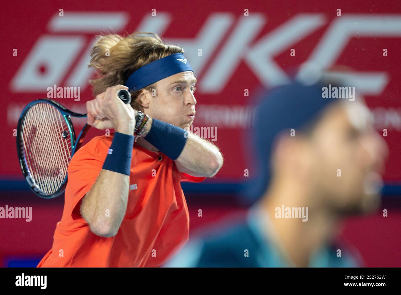 ( L ) Andrey Rublev of Russia return a shot to JiSung Nam and Coleman ...