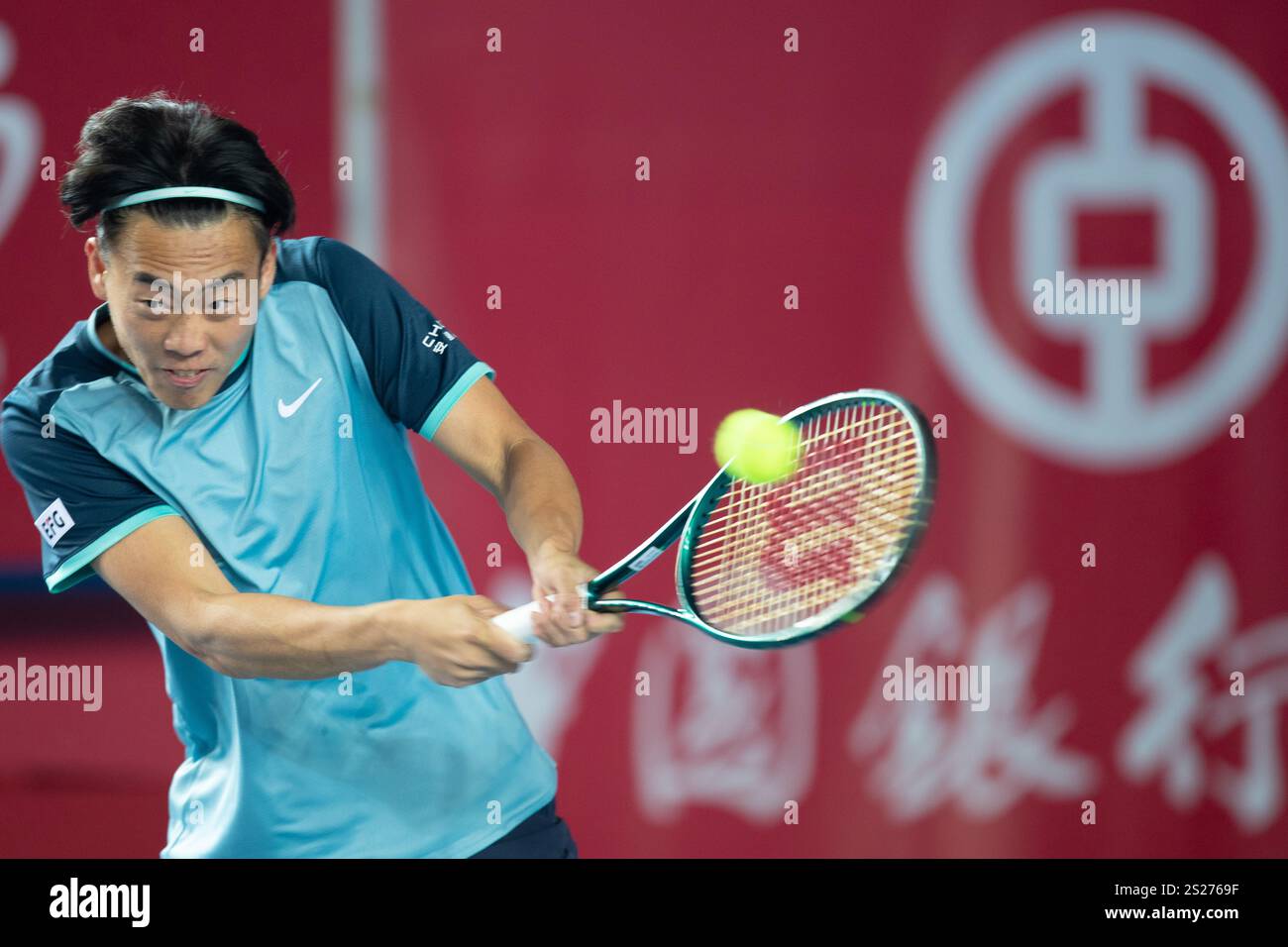 Coleman Wong Chak-lam of Hong Kong returns a shot to Karen Khachanov ...