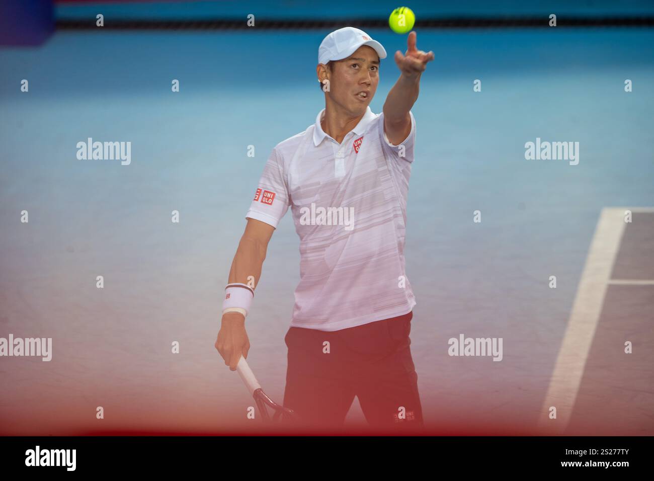 Kei Nishikori of Japan serves against Alexandre Muller of France during ATP 250 Hong Kong Tennis ...