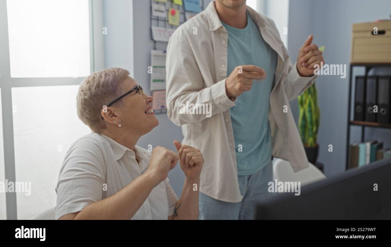 Woman and man enjoying work in a cheerful office setting, showcasing ...