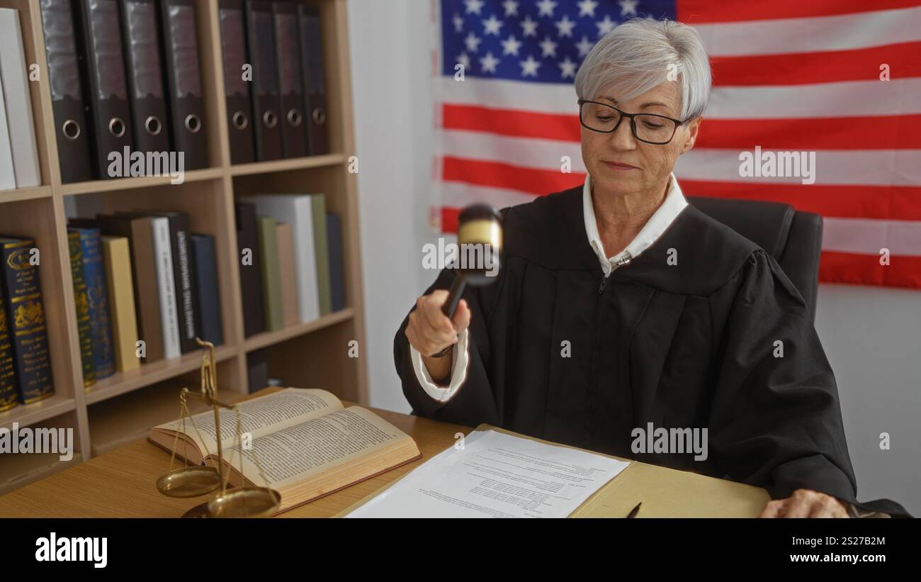 Mature woman judge with short grey hair wearing glasses and a black ...