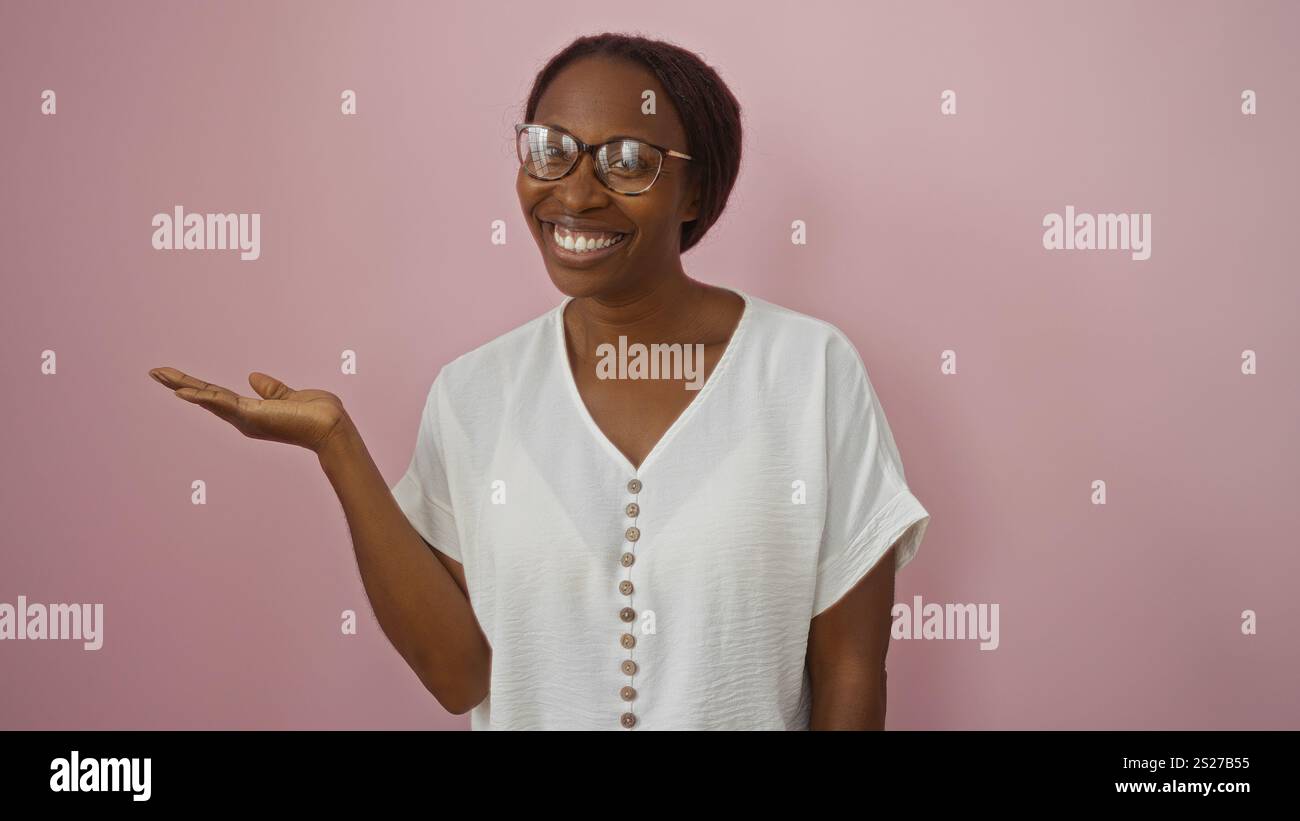 Beautiful young african american woman presenting something with a ...