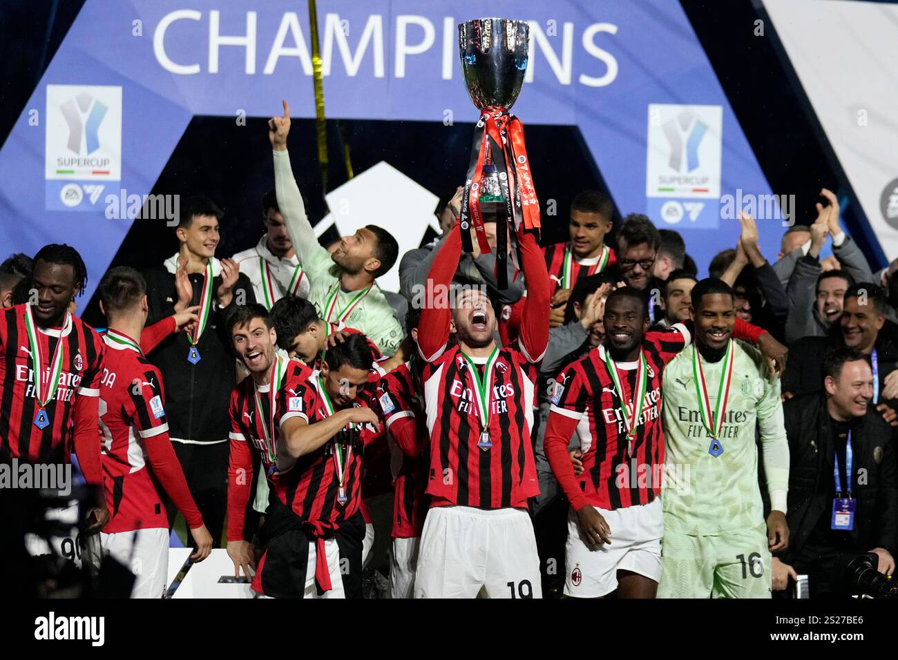 AC Milan's team celebrates after winning the Italian Super Cup final ...