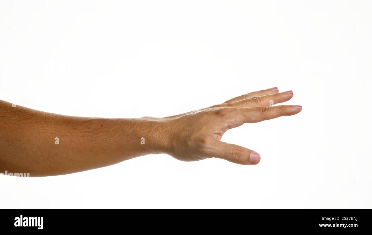 Man hand extended with fingers spread on an isolated white background ...
