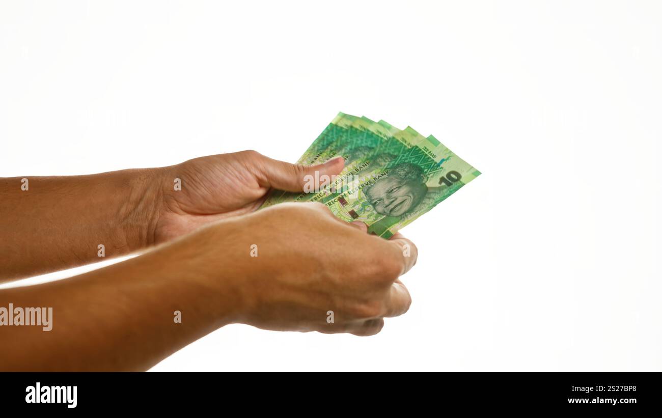 Hand holding south african rands with mandela's face over an isolated ...