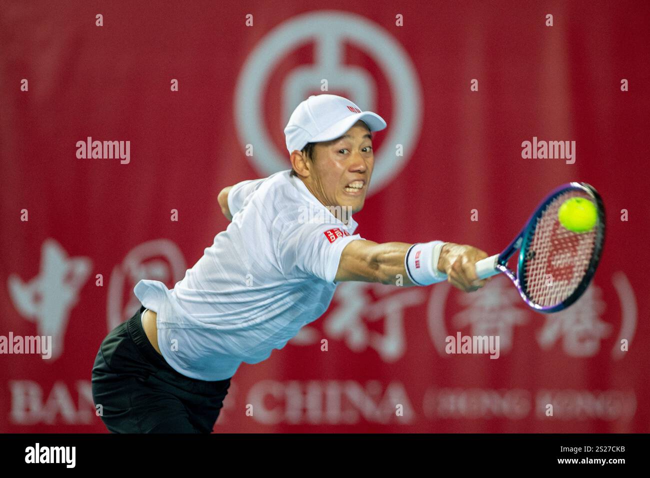 Kei Nishikori of Japan hits a backhand groundstroke against Alexandre Muller of France during ...