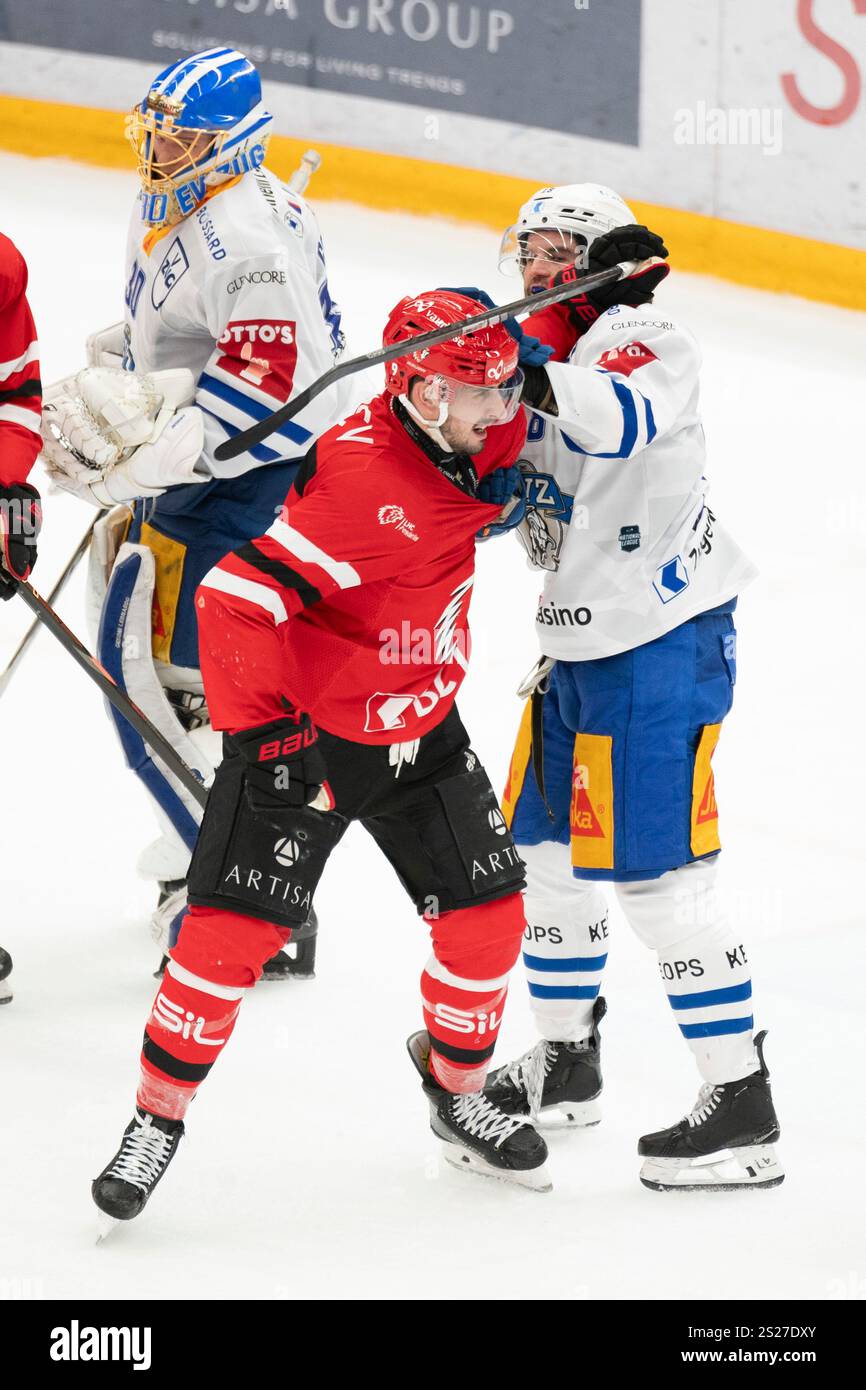 Lausanne, Switzerland. , . tension grows between Damien Riat (offense) of Lausanne HC #9 and ...