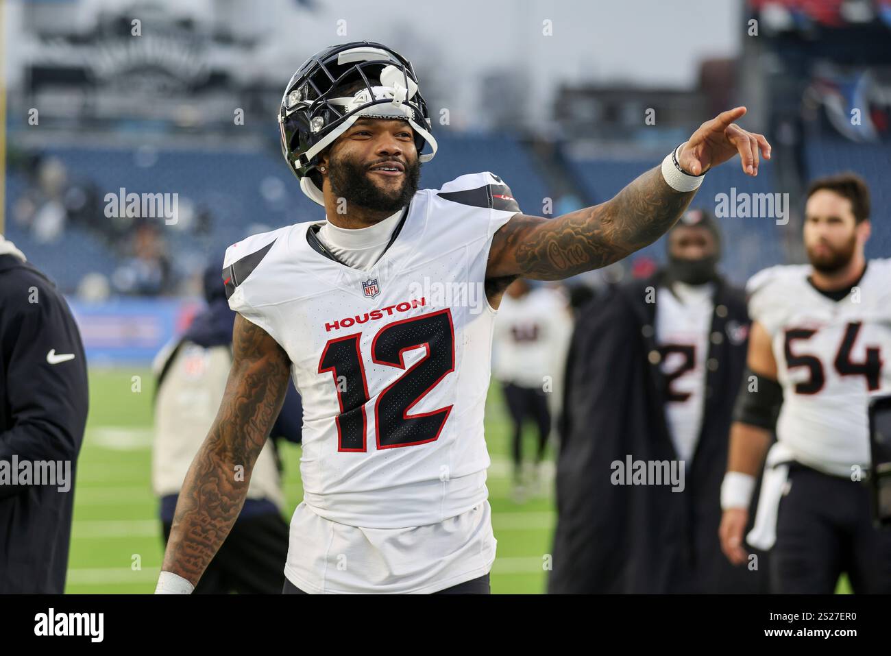 Houston Texans wide receiver Nico Collins (12) walks off the field ...