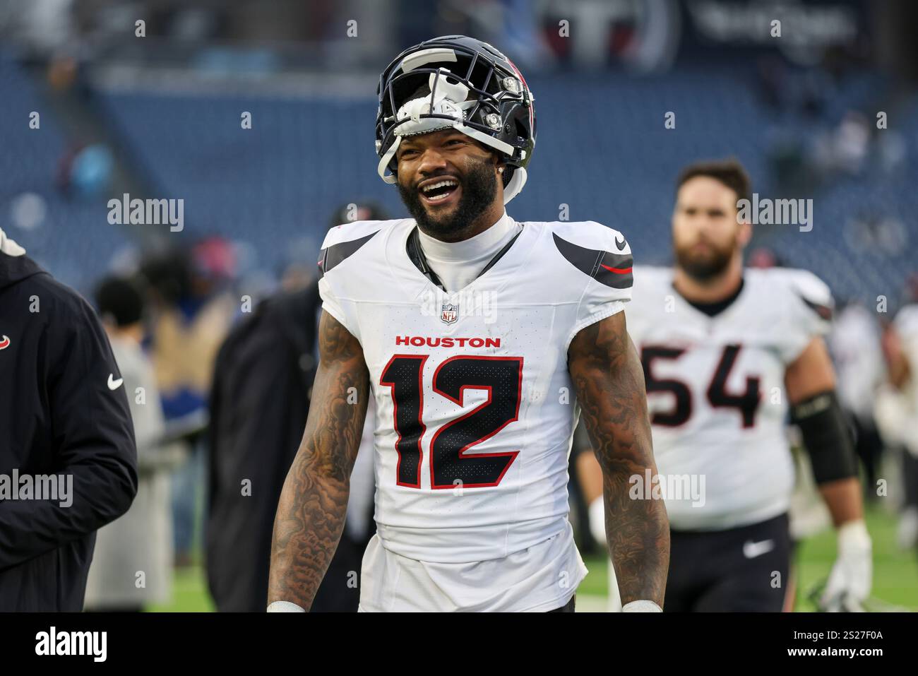 Houston Texans wide receiver Nico Collins (12) walks off the field ...