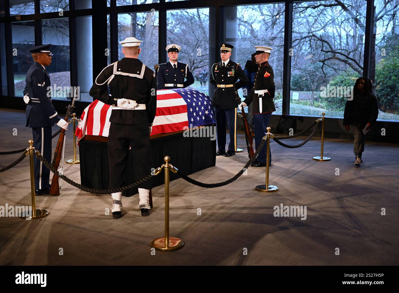The guard of honor changes as mourners view the casket of former President Jimmy Carter as he ...