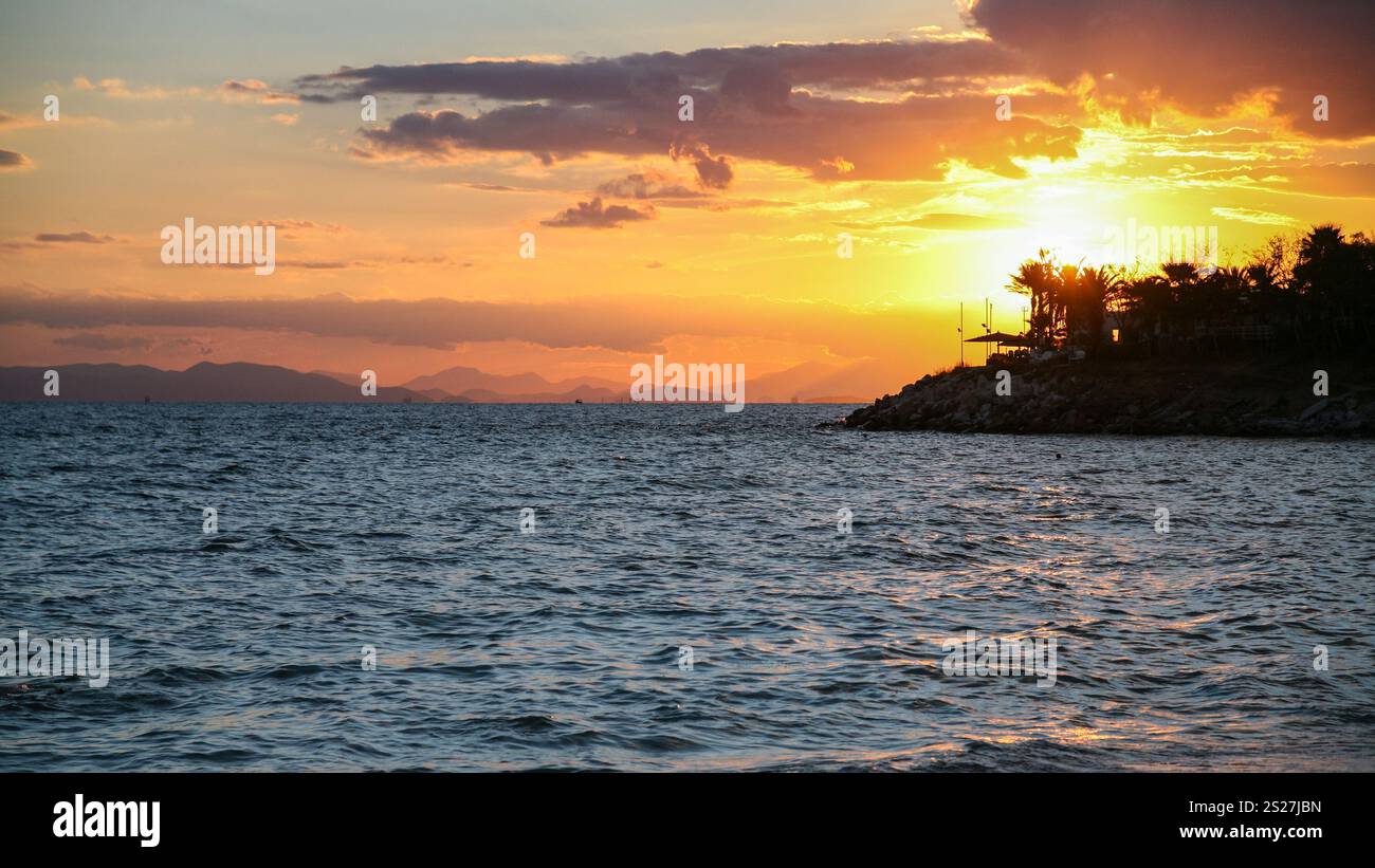 travel to Greece - yellow sunset on Saronic Gulf of Aegean Sea in ...