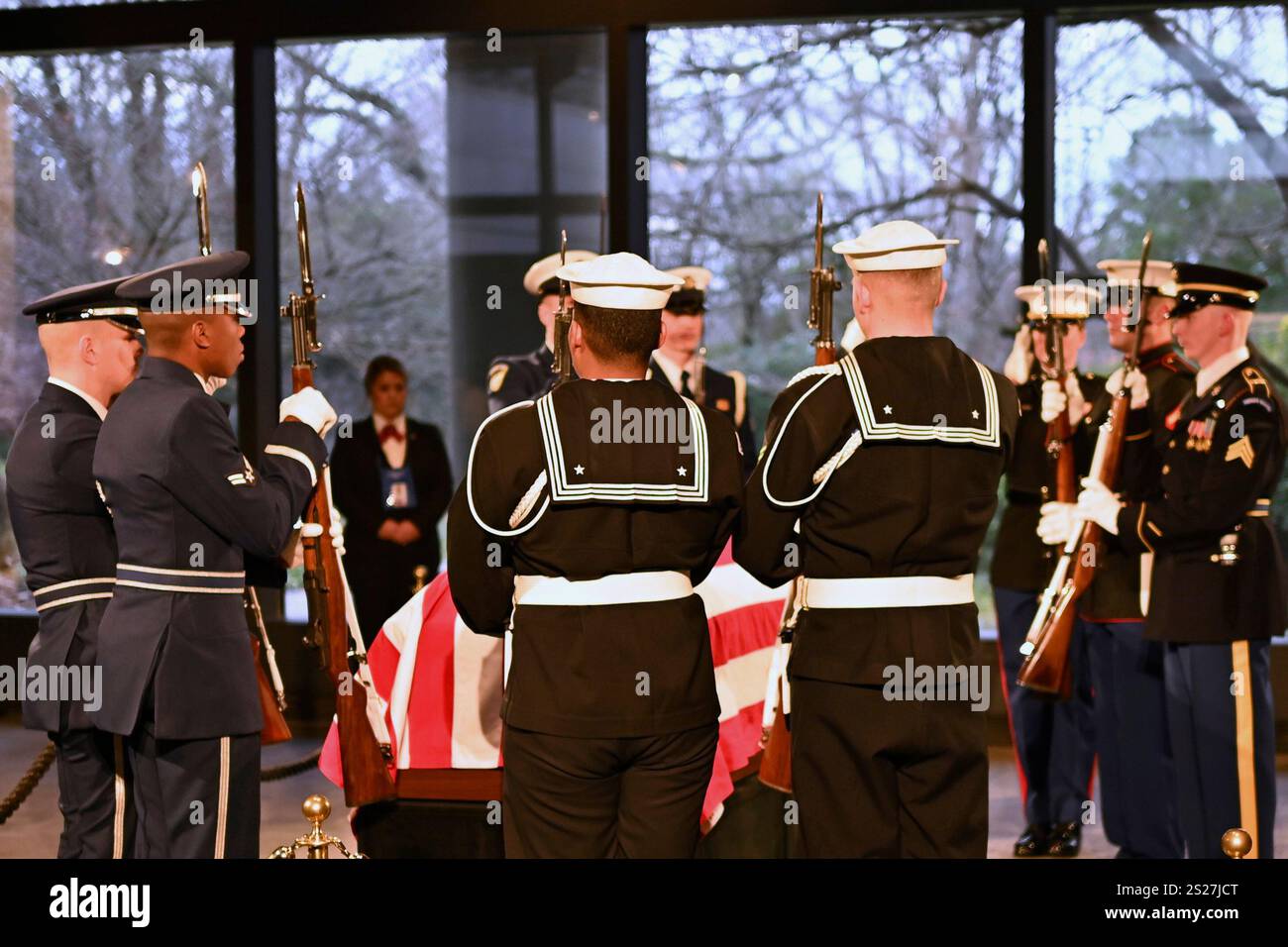 A military honor guard changes positions at the casket of former President Jimmy Carter as he ...