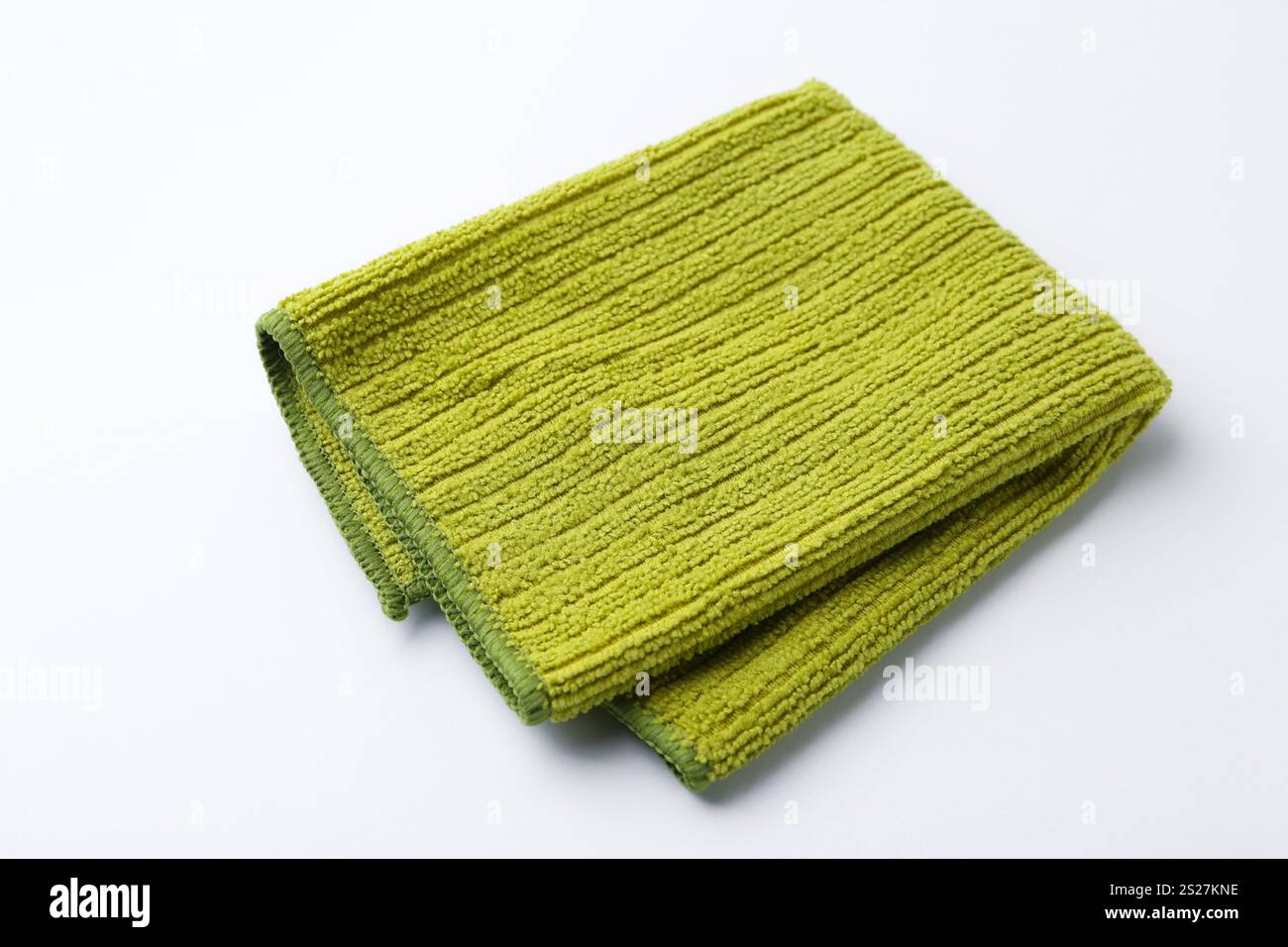 Clean green microfiber cloth on white background, closeup Stock Photo ...