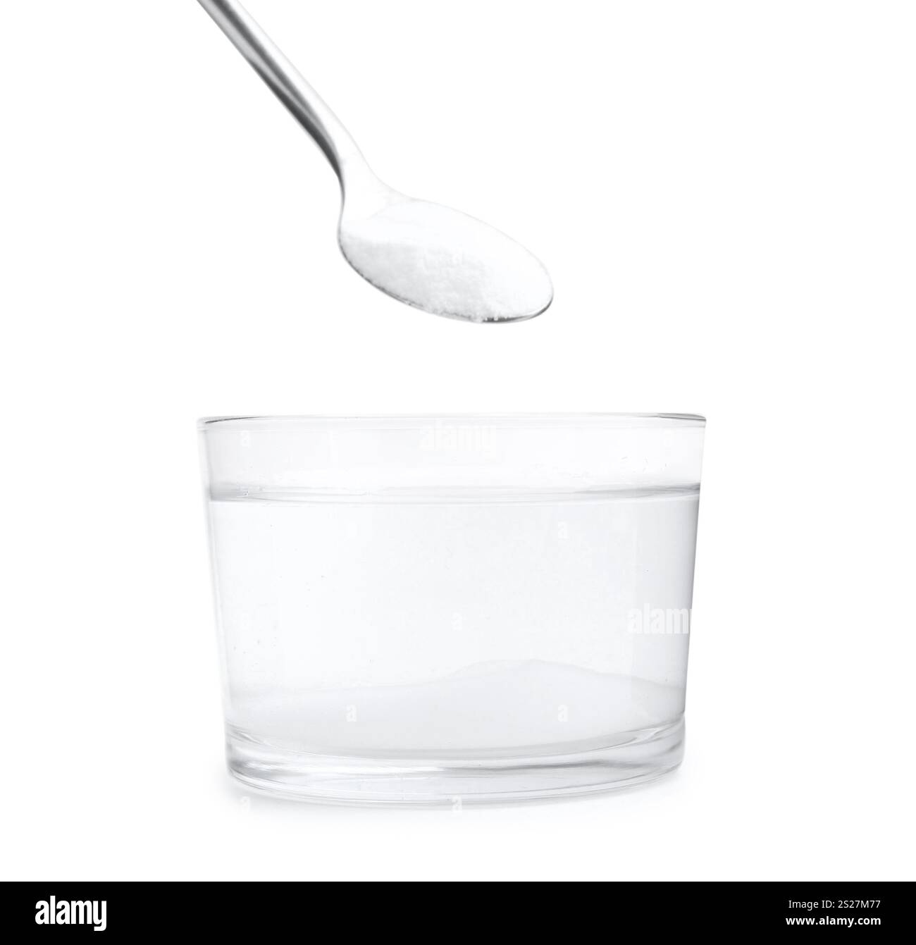 Adding baking soda to glass of water isolated on white, closeup Stock ...