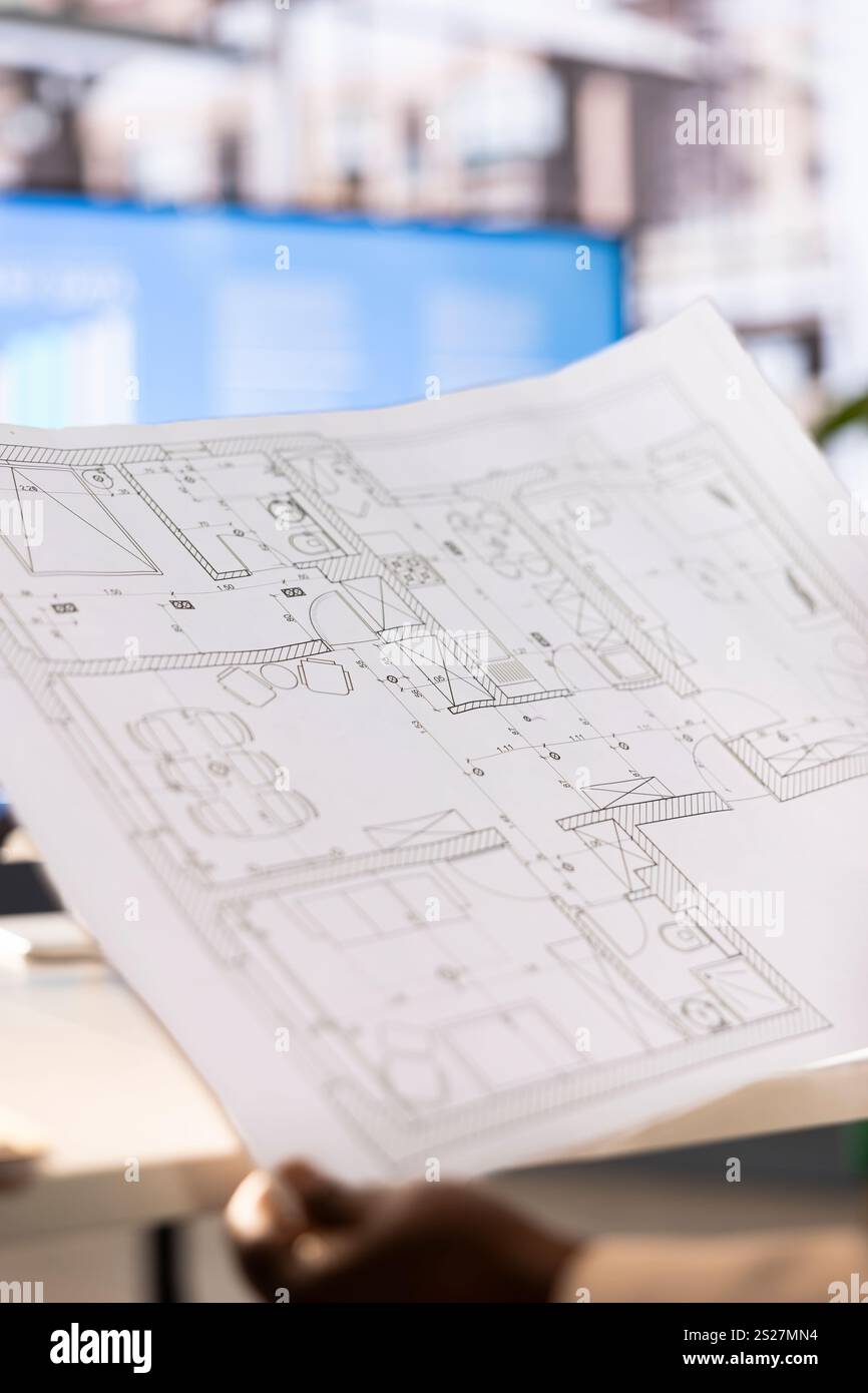 Architect drawing schematics providing technical and aesthetic advice ...