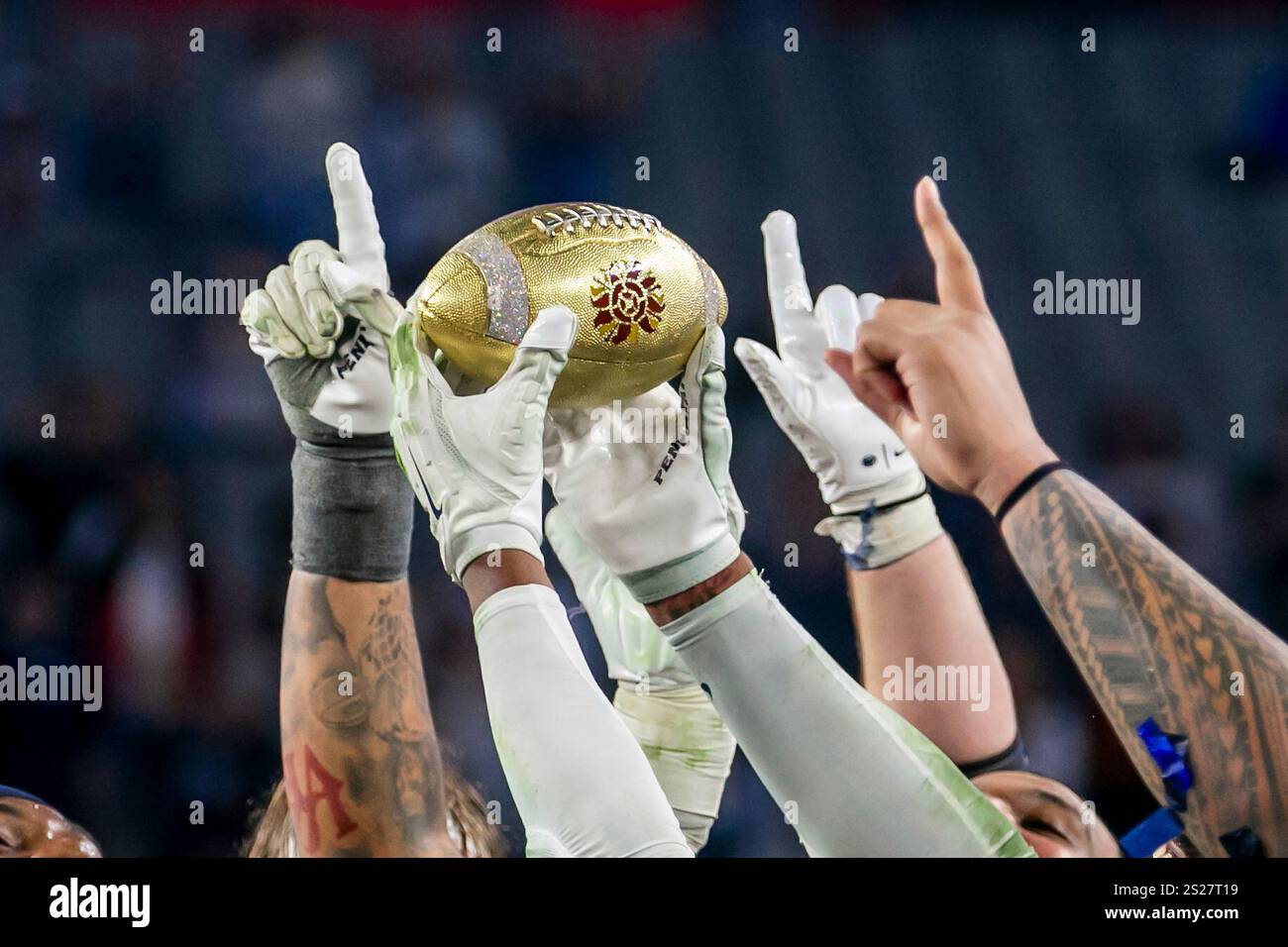GLENDALE, AZ - DECEMBER 31: Members of the Penn State Football hold up the championship trophy ...