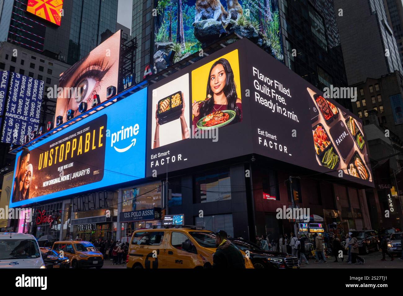 Times Square is brightly lit with electronic billboards, 2025, New York ...