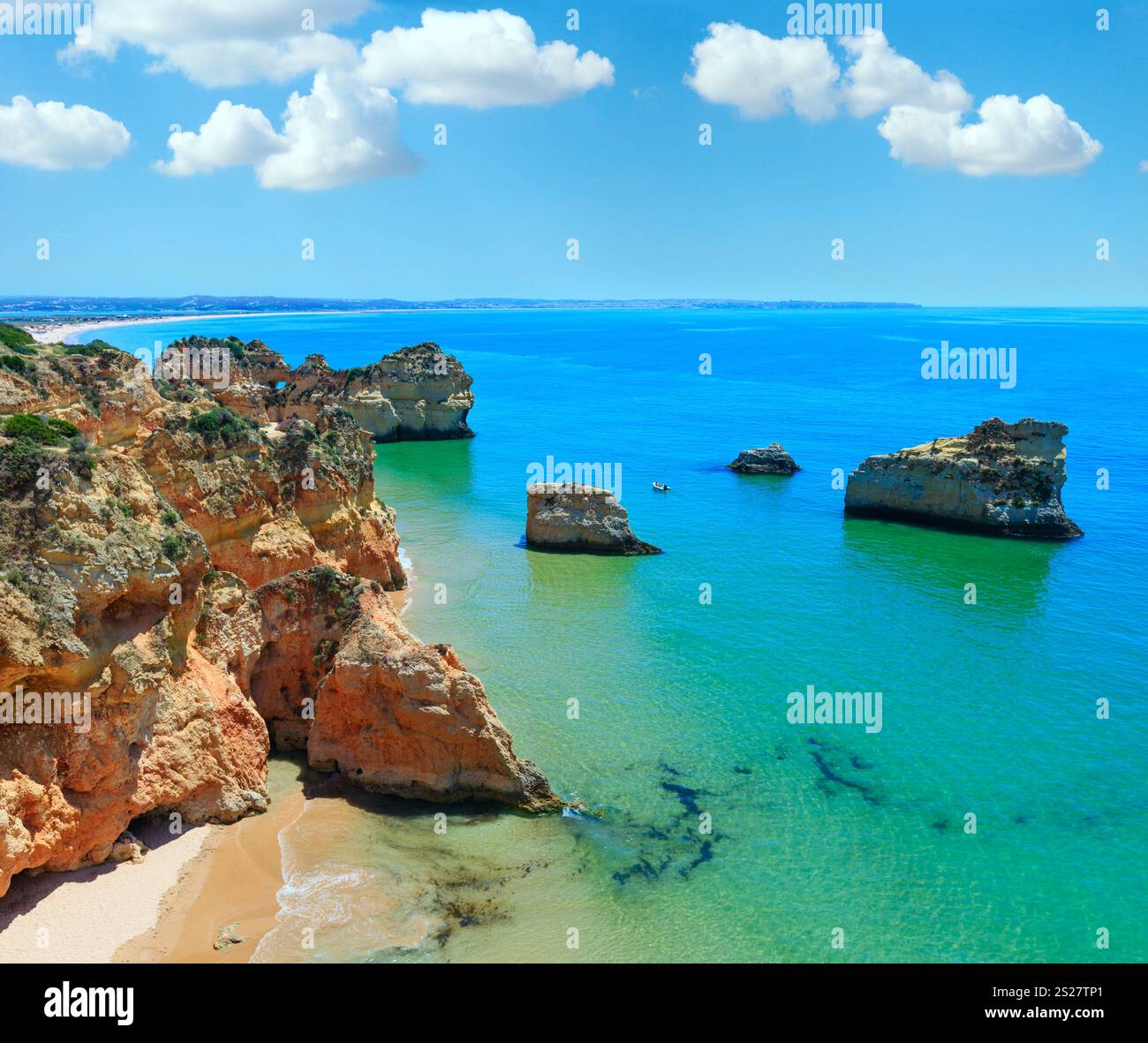 Rocks near beach Dos Tres Irmaos. Top view with blue sky (Portimao ...