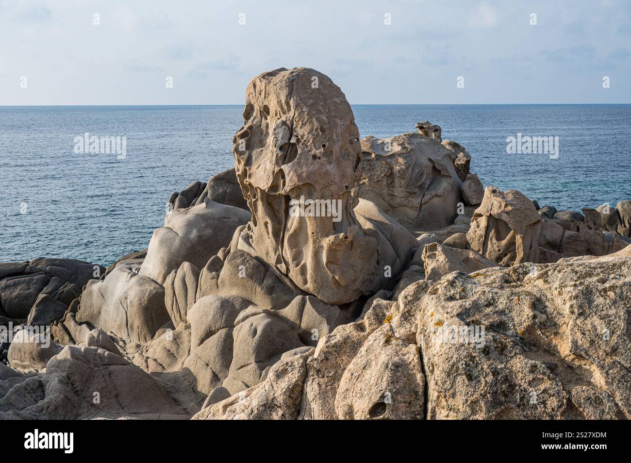 Wind-eroded rocks illuminated by the sun in the beautiful Punta Molentis beach in Villasimius ...