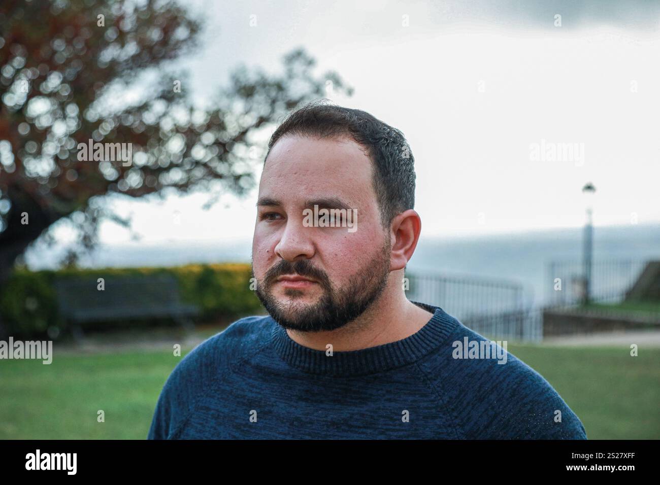Curious Man Looking Out For Someone Stock Photo - Alamy
