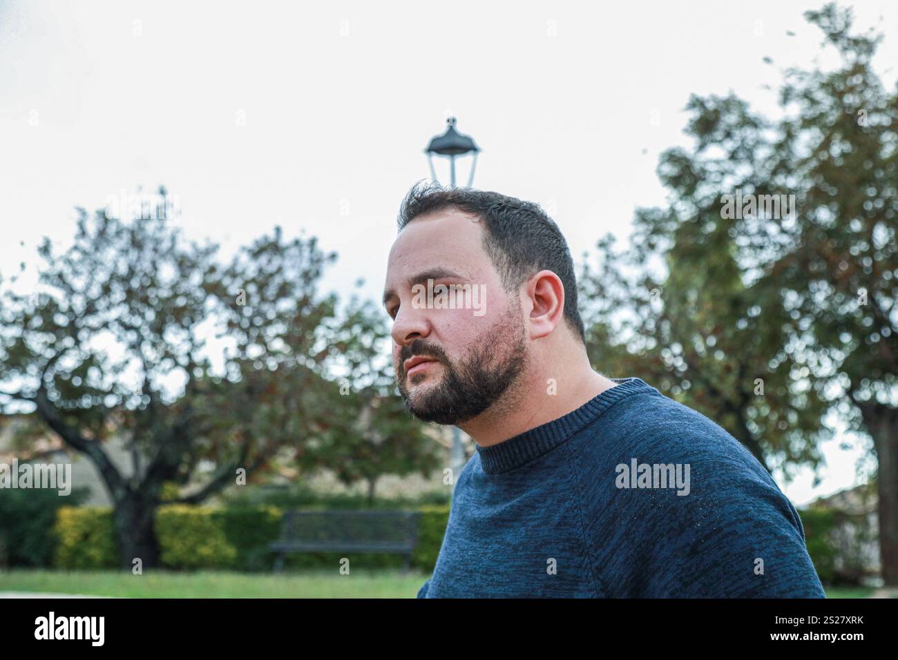 Curious Man Looking Out For Someone Stock Photo - Alamy