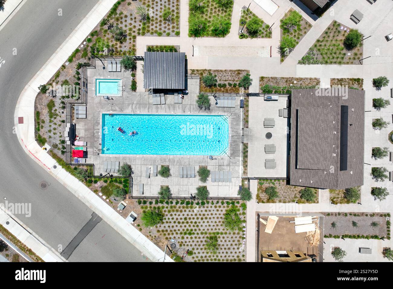 Aerial video of recreational facilities with pool in private ...