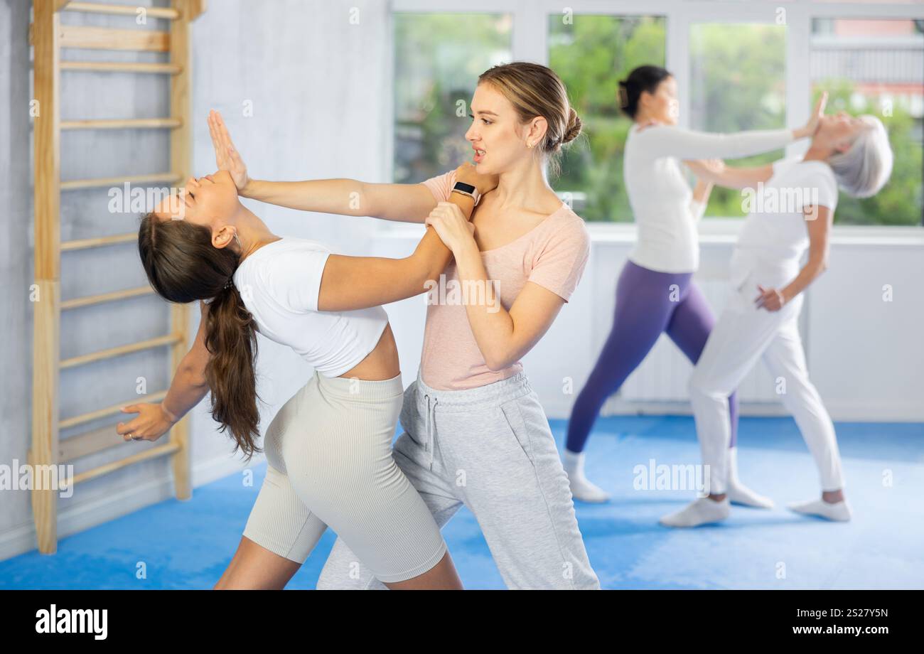 Two young women training self-defense techniques Stock Photo - Alamy