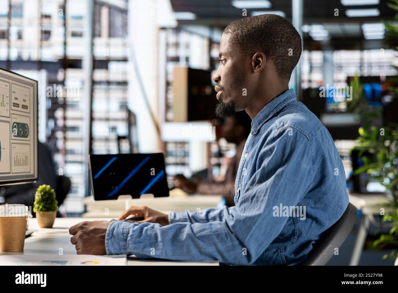 Executive manager in modern office engaged in infographics analysis for ...