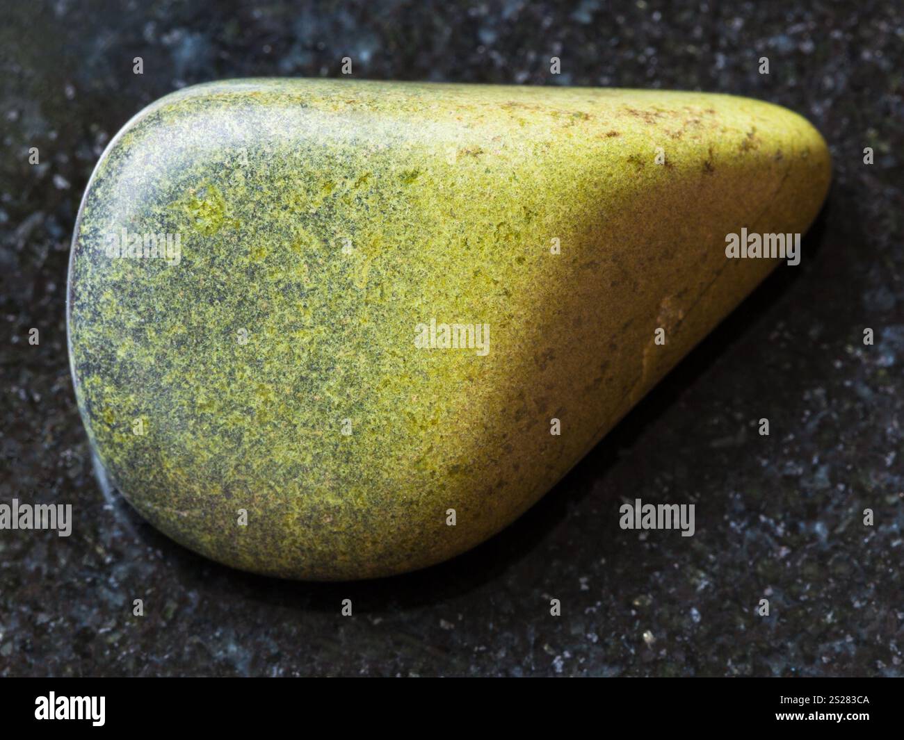 macro shooting of natural mineral rock specimen - polished epidote ...