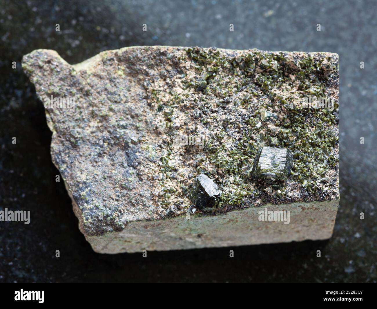 macro shooting of natural mineral stone specimen - raw green crystals ...