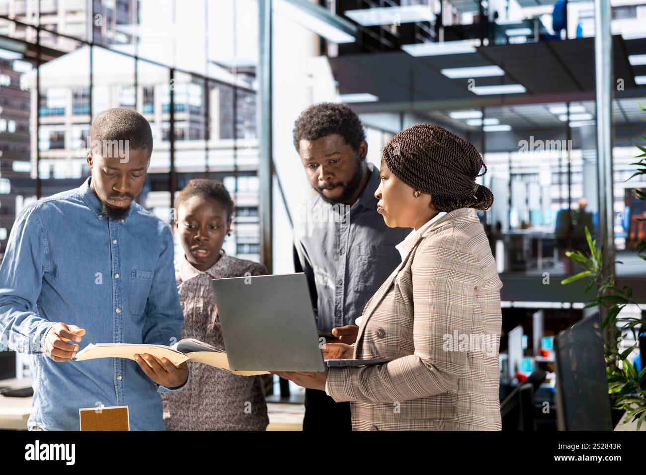 African american executive team are engaged in administrative tasks ...