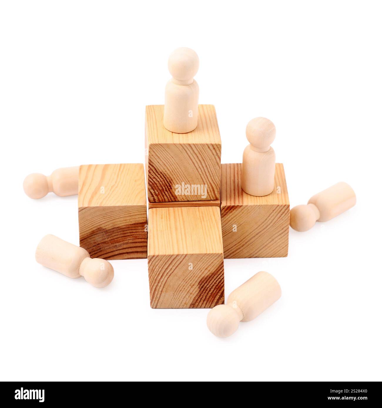 Human figures on wooden blocks near fallen ones against white ...