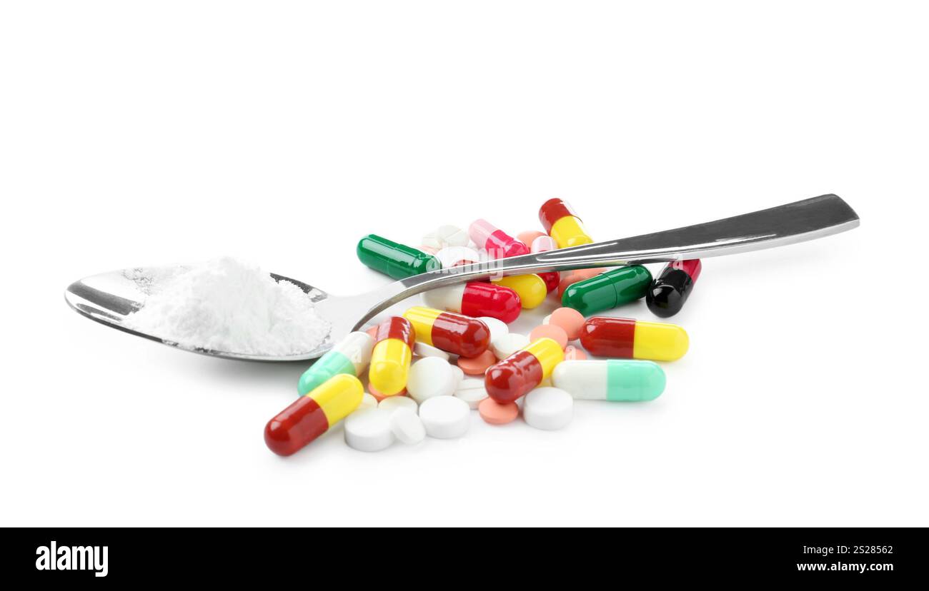 Drug addiction. Different pills and spoon with powder isolated on white ...