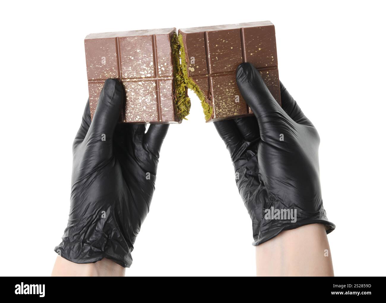 Woman breaking Dubai chocolate bar with pistachio and knafeh on white ...