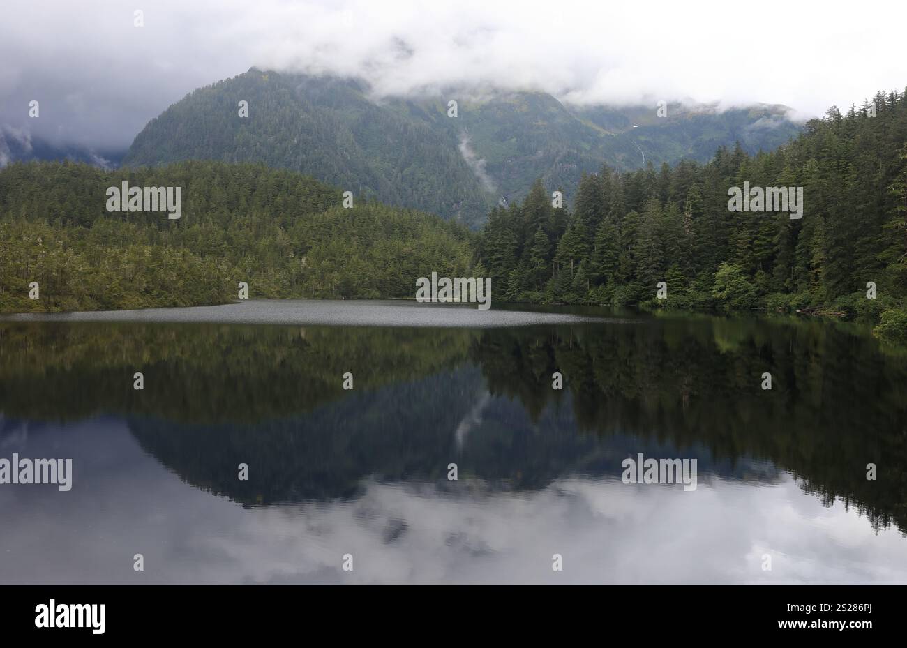 Blue lake reflection Stock Photo - Alamy